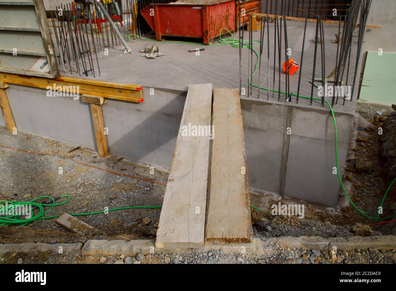 Makeshift transition through wooden boards over a pit Stock Photo - Alamy