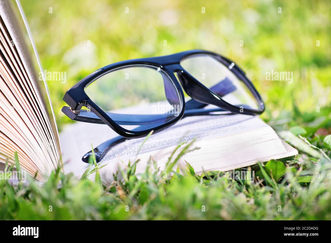 Open book with glasses on hi-res stock photography and images - Alamy