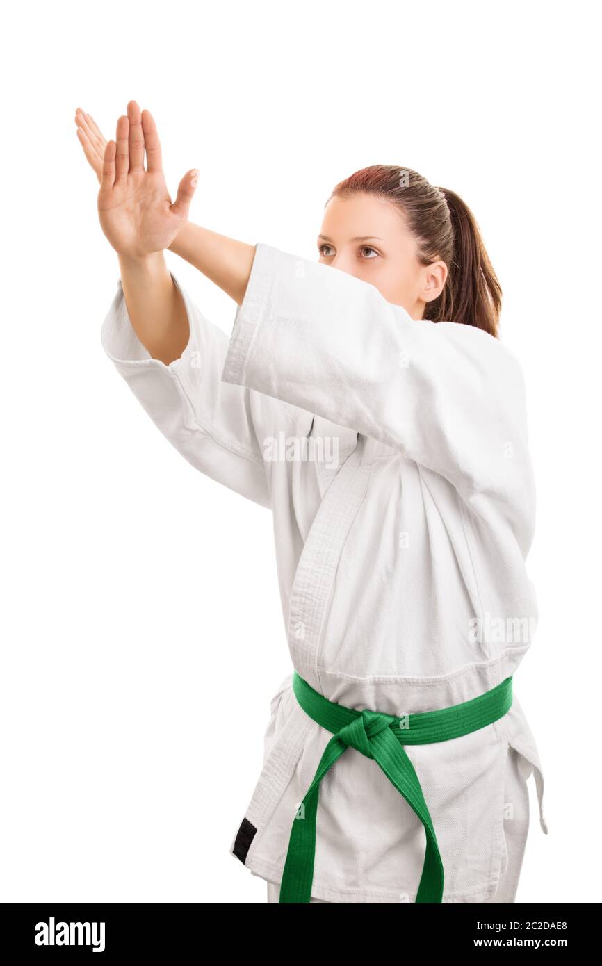 Block this way. Young girl wearing kimono with green belt in block ...