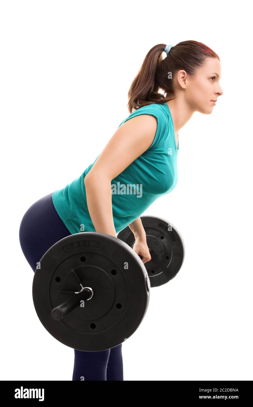 Lift! Young girl athlete lifting weights, isolated on white background ...