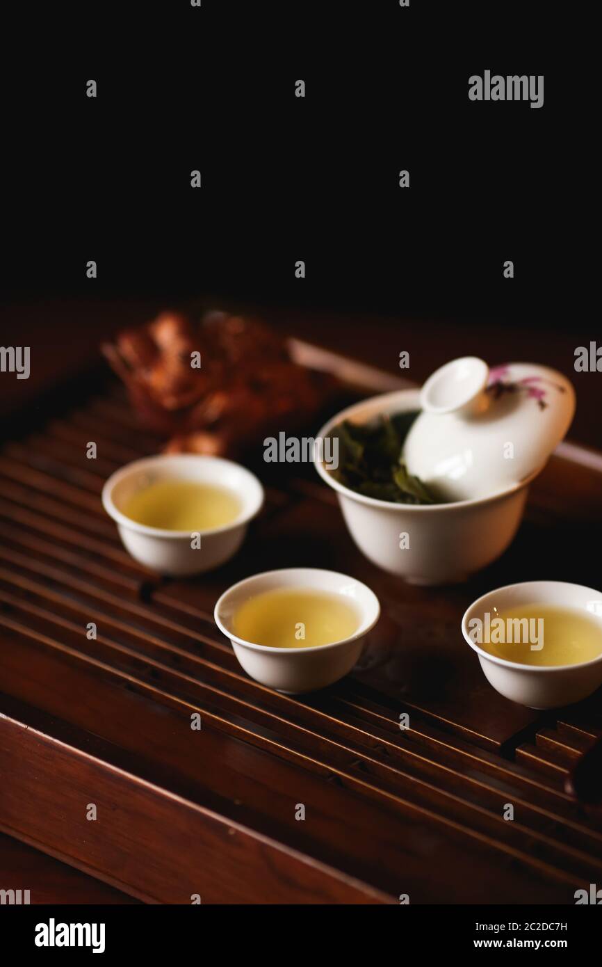 Chinese tea ceremony. Tea set on tea desk chaban with golden frog. Soft ...