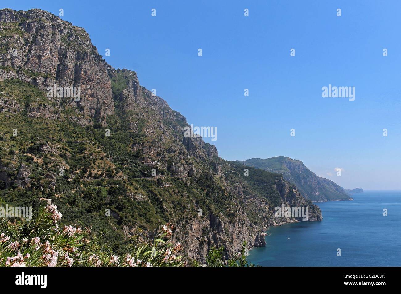 Tall mountains cliff next to Mediterranean sea coast Stock Photo - Alamy