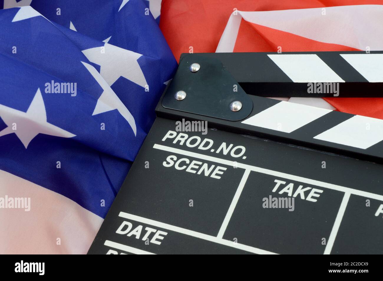 A movie clapboard and American flag for representing the American made ...