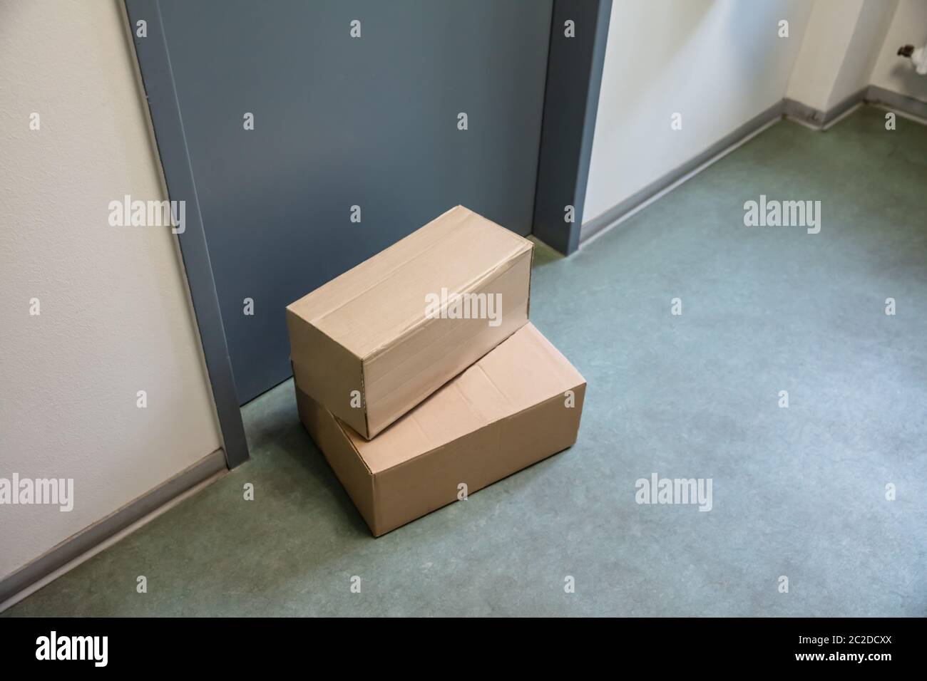 Close-up Of Cardboard Parcel Boxes Delivered Outside Front Door Stock ...