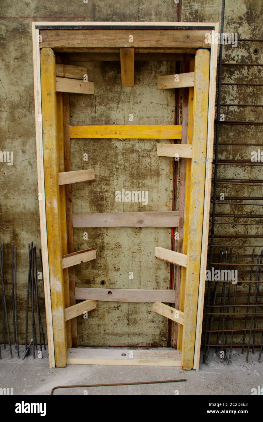 Prepared recess for a door in a concrete wall Stock Photo - Alamy