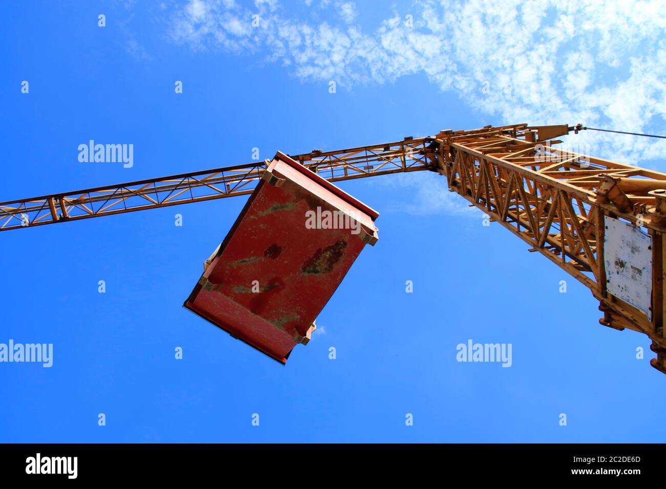 flying load under a construction crane Stock Photo - Alamy