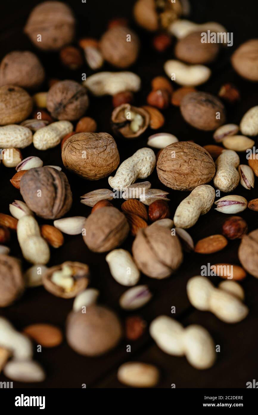 Mixed nuts. Group of mixed nuts on black background Stock Photo - Alamy