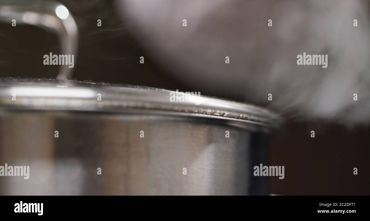 Cooking with steam coming out from kettle in the kitchen Stock Photo ...
