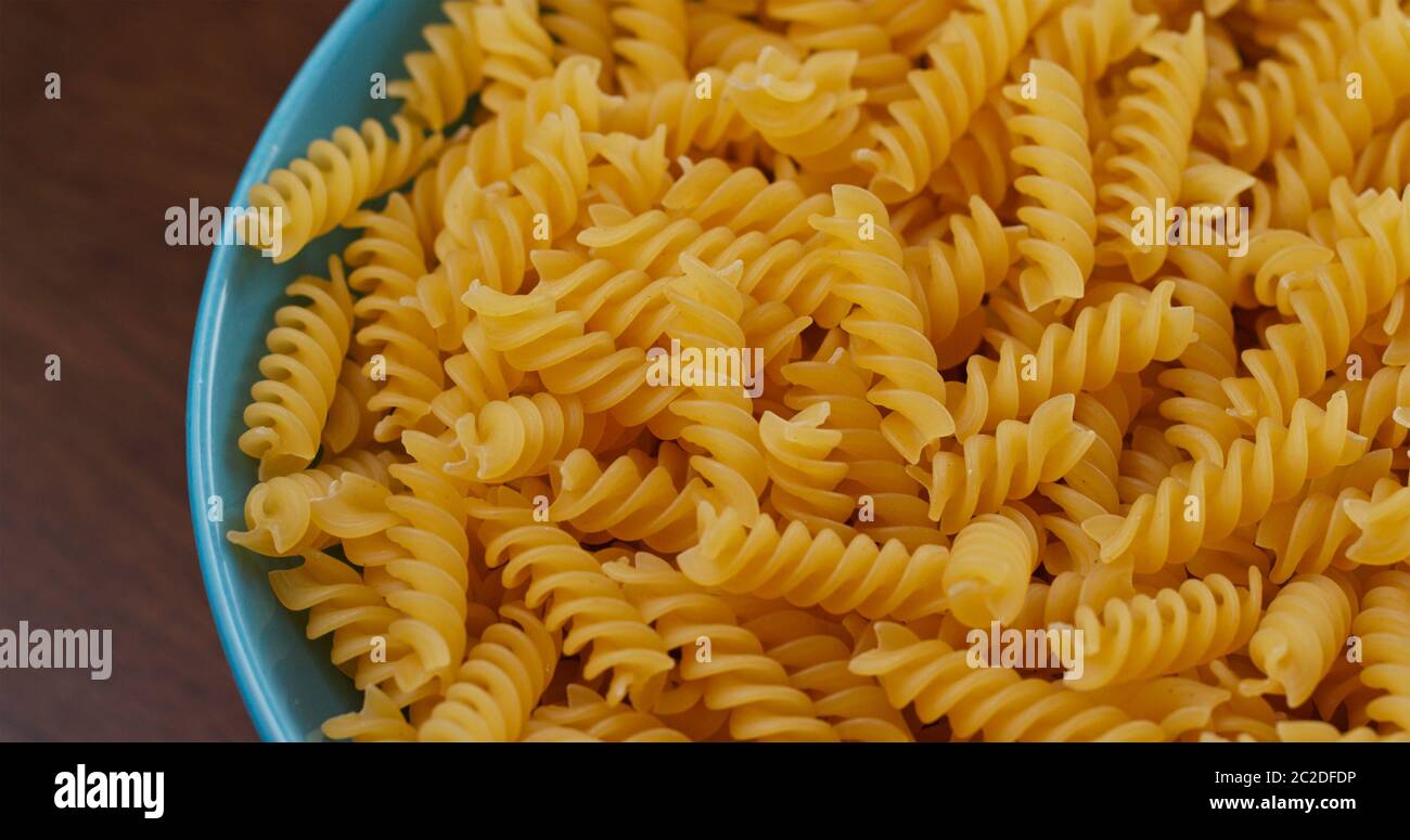 Heap of fusilli on plate Stock Photo - Alamy