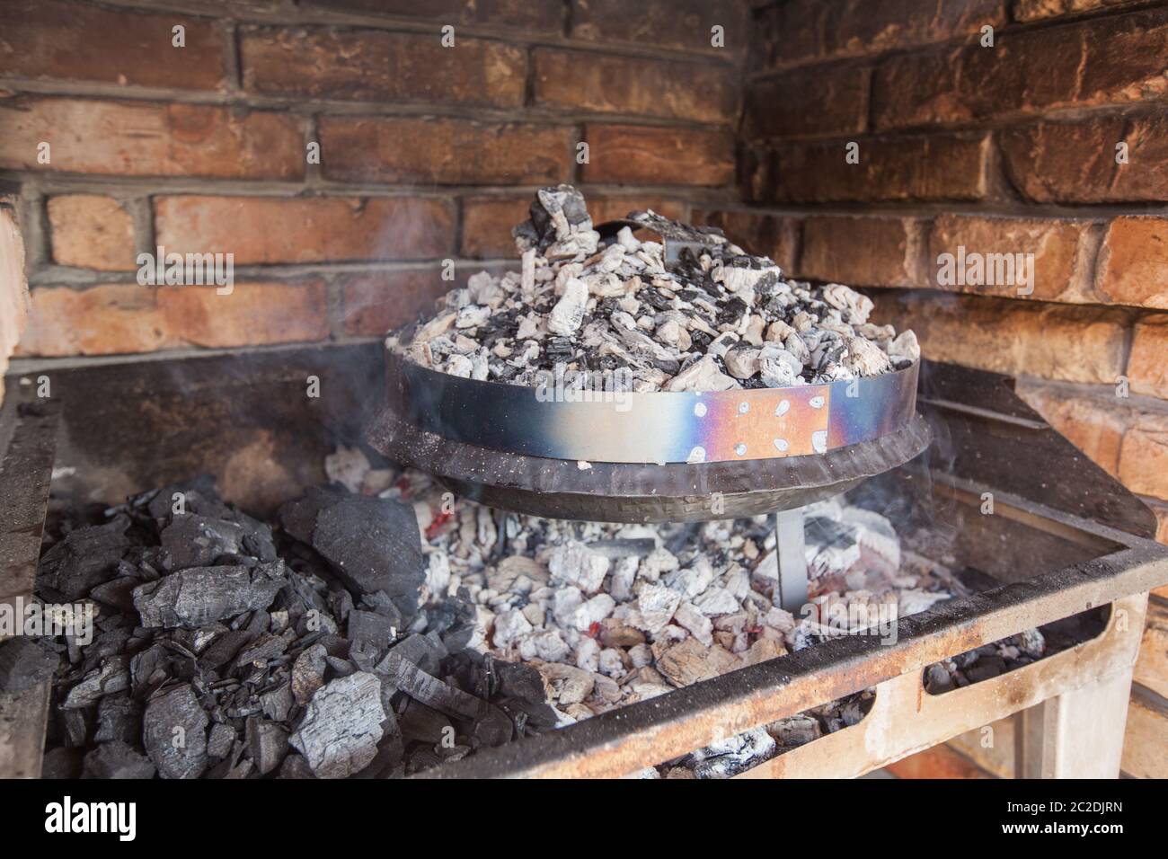 Traditional Balkans Food Preparation , cooking under the lid covering ...