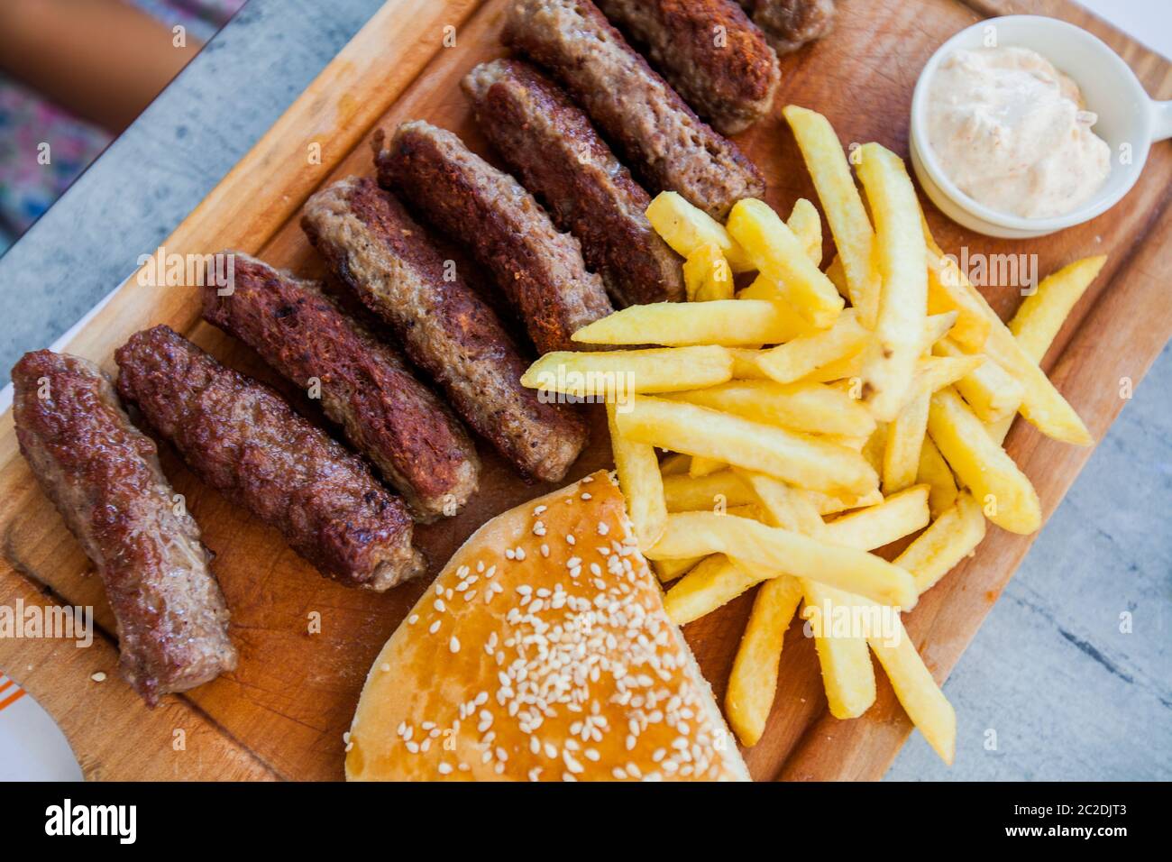 Grilled minced meat. Traditional Balkan food. Served with french fries ...