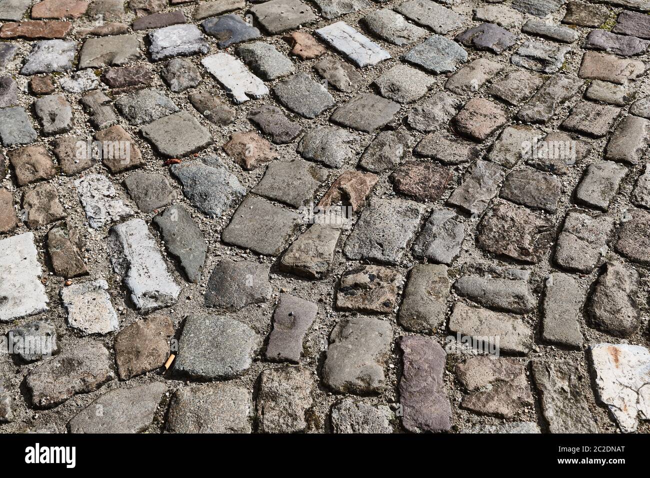 Dark pavement made of old stones Stock Photo - Alamy