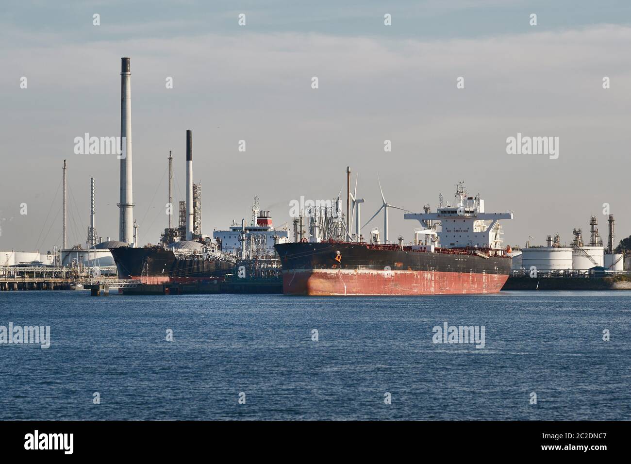 Large crude oil tanker arrived to the refinery dock Stock Photo - Alamy