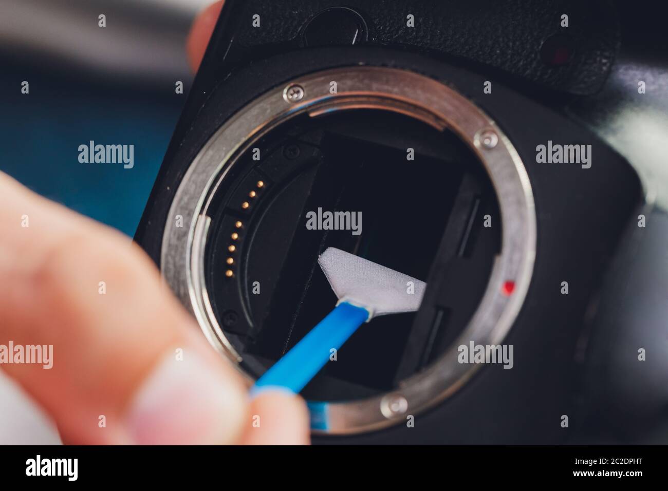 Cleaning dirty camera sensor. Digital photo camera with cleaning tools ...