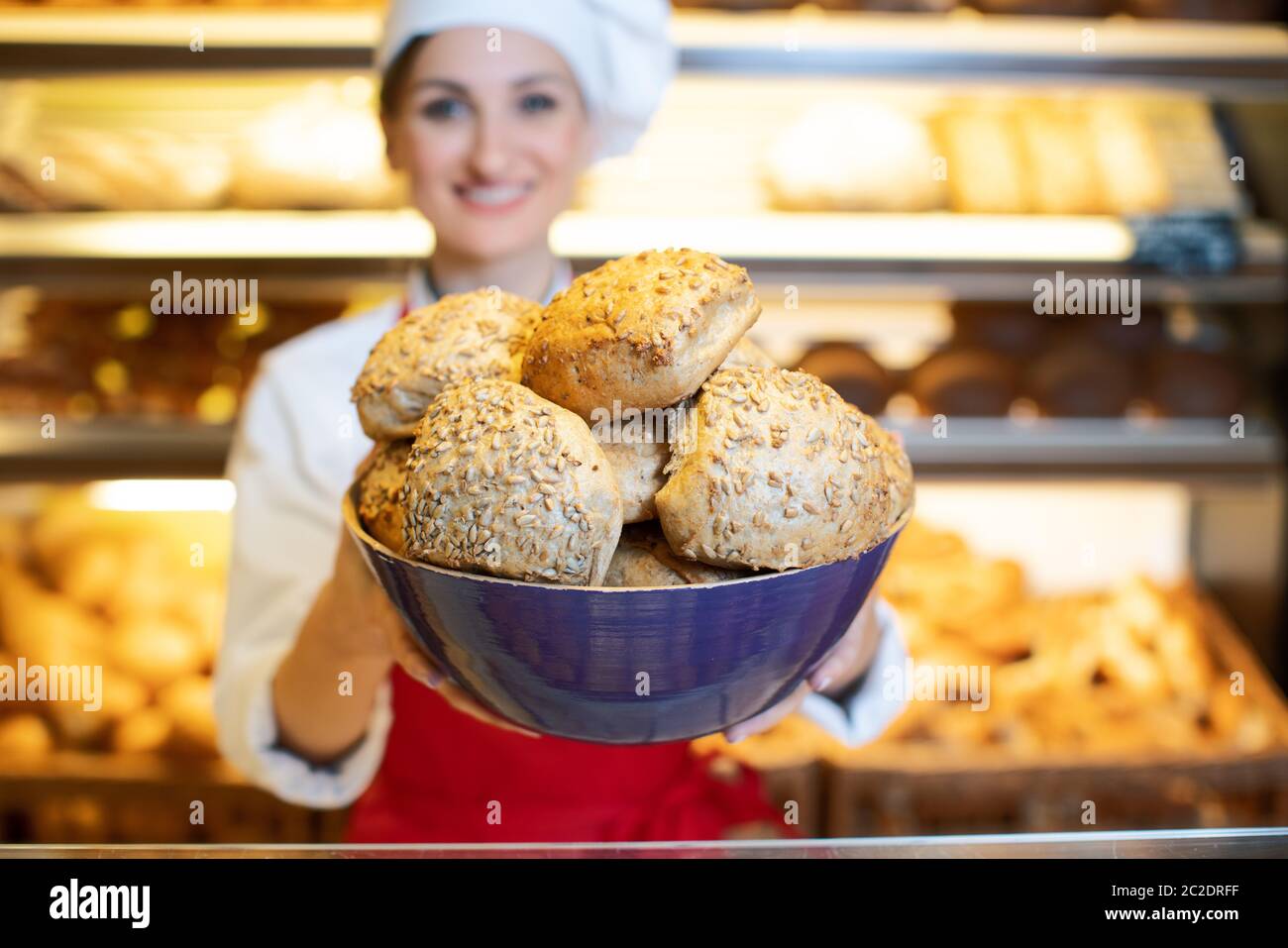 Bread bakery offering woman hi-res stock photography and images - Alamy