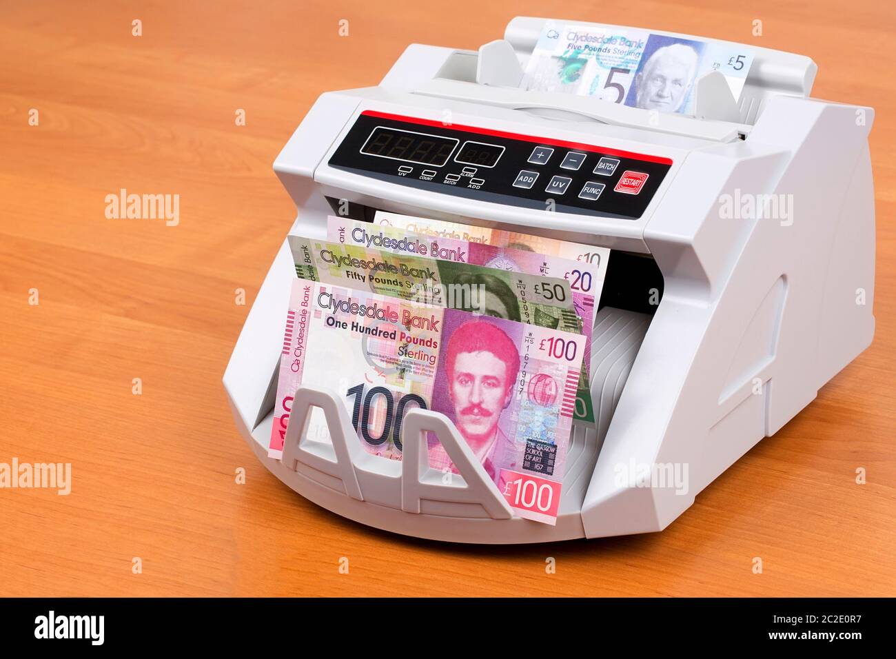 Scottish Pounds in a counting machine Stock Photo - Alamy