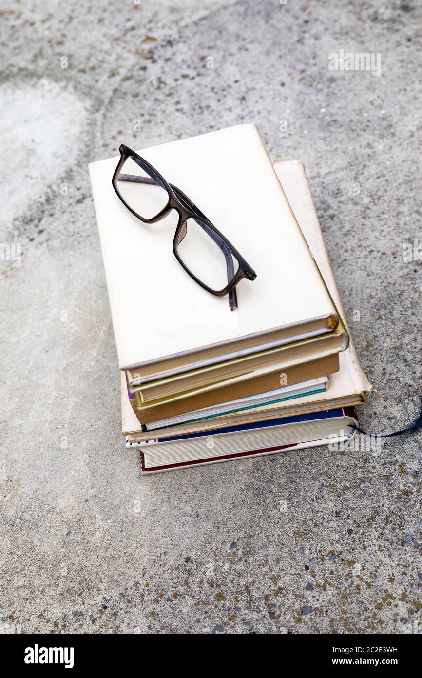 books and reading glasses Stock Photo - Alamy
