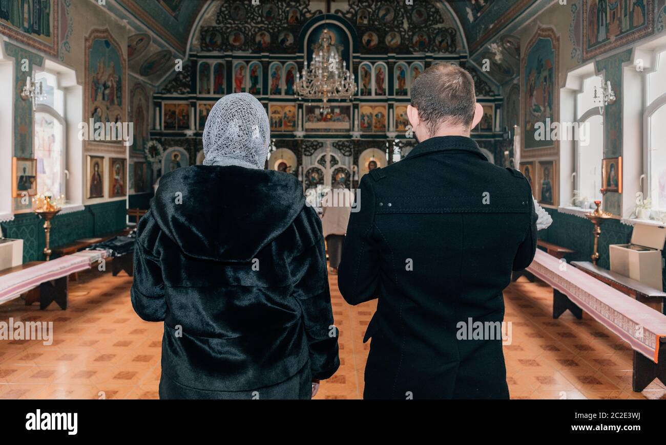 Mom and dad on ceremony of child christening in church. Today, the baby ...