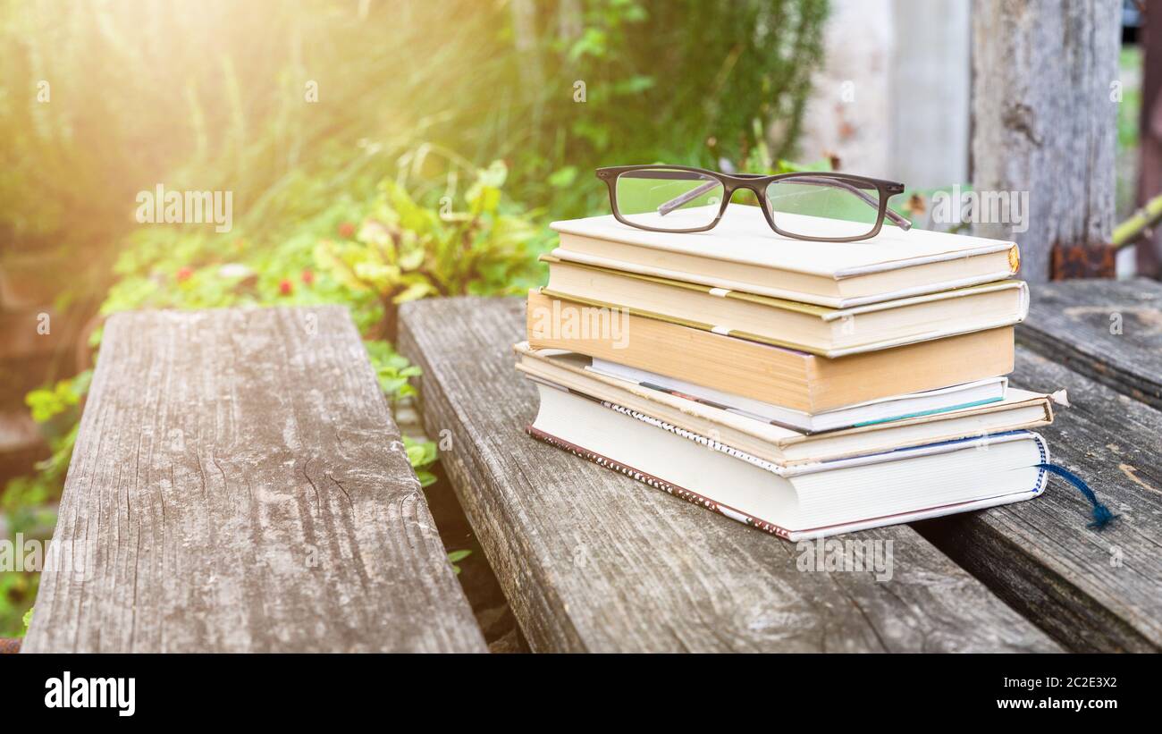books and reading glasses Stock Photo - Alamy