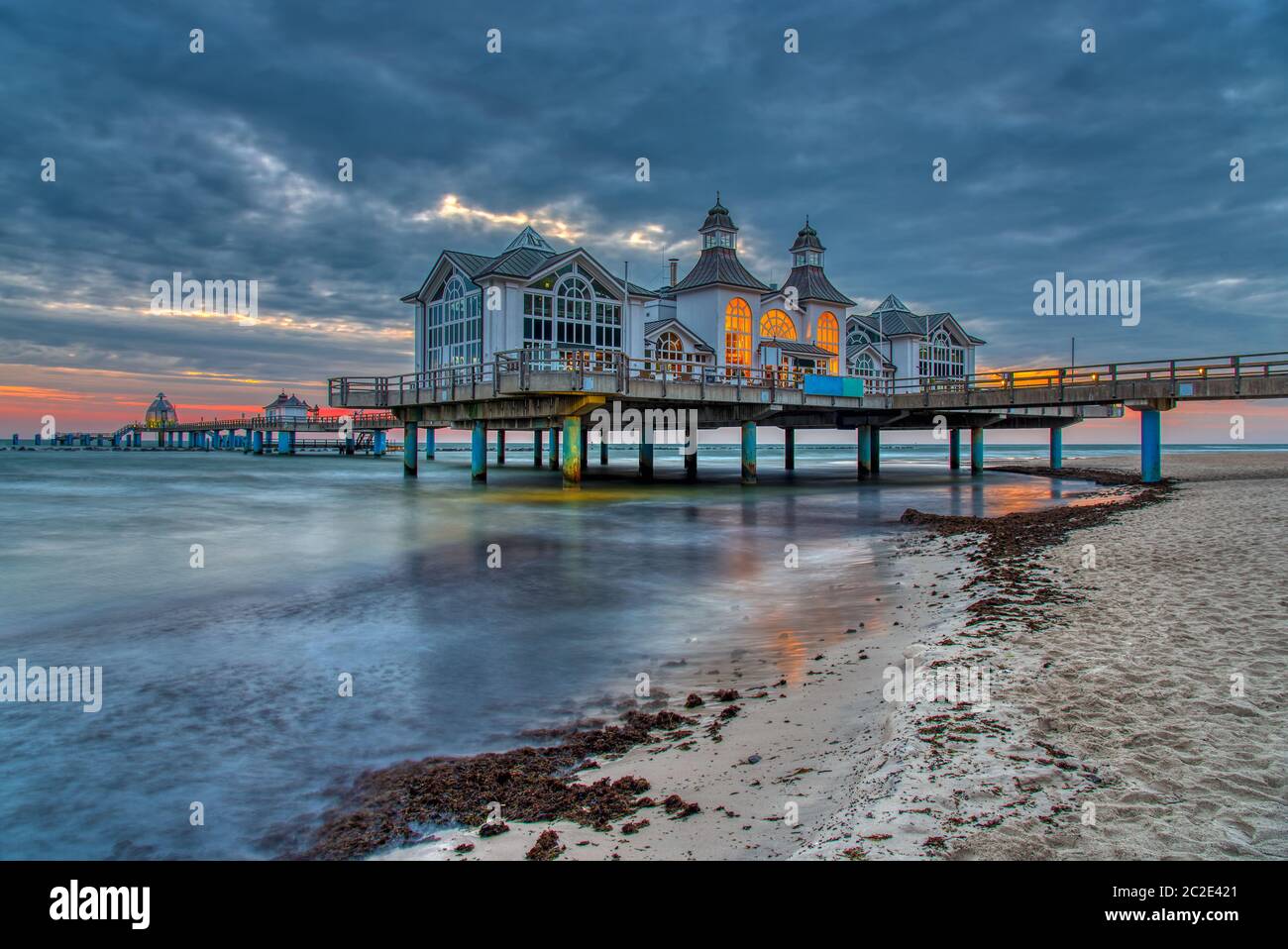 The sea pier of Sellin on Ruegen island in Germany with dark clouds ...