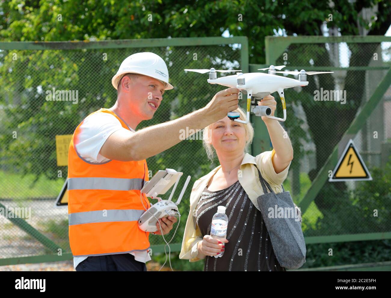 Quadcopter flying, operator controlling it on a background. July 11 ...