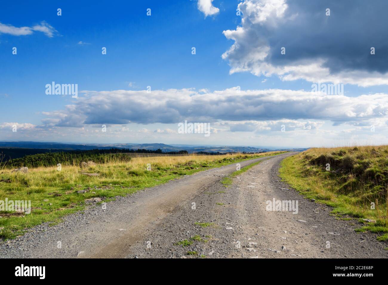 Countryside landscape and road on a cloudy summer day Stock Photo - Alamy
