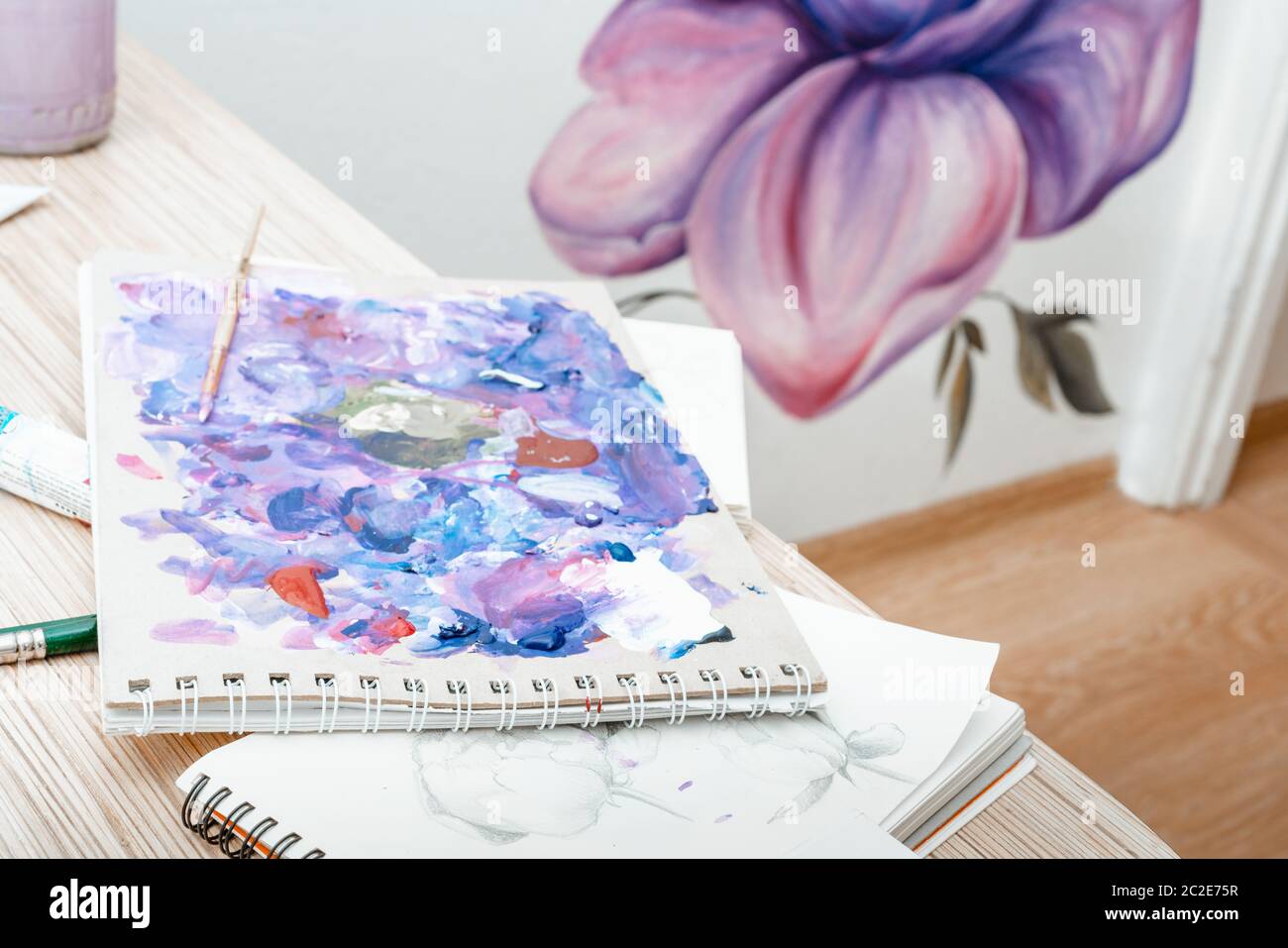 Tools of the artist. Palette, paints, brushes during use. Creativity ...