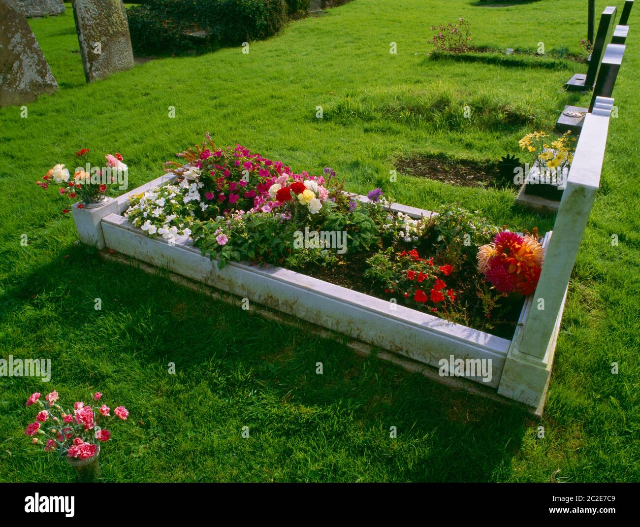 A grave much-visited & well cared for by a widower at St Cadog's Church ...