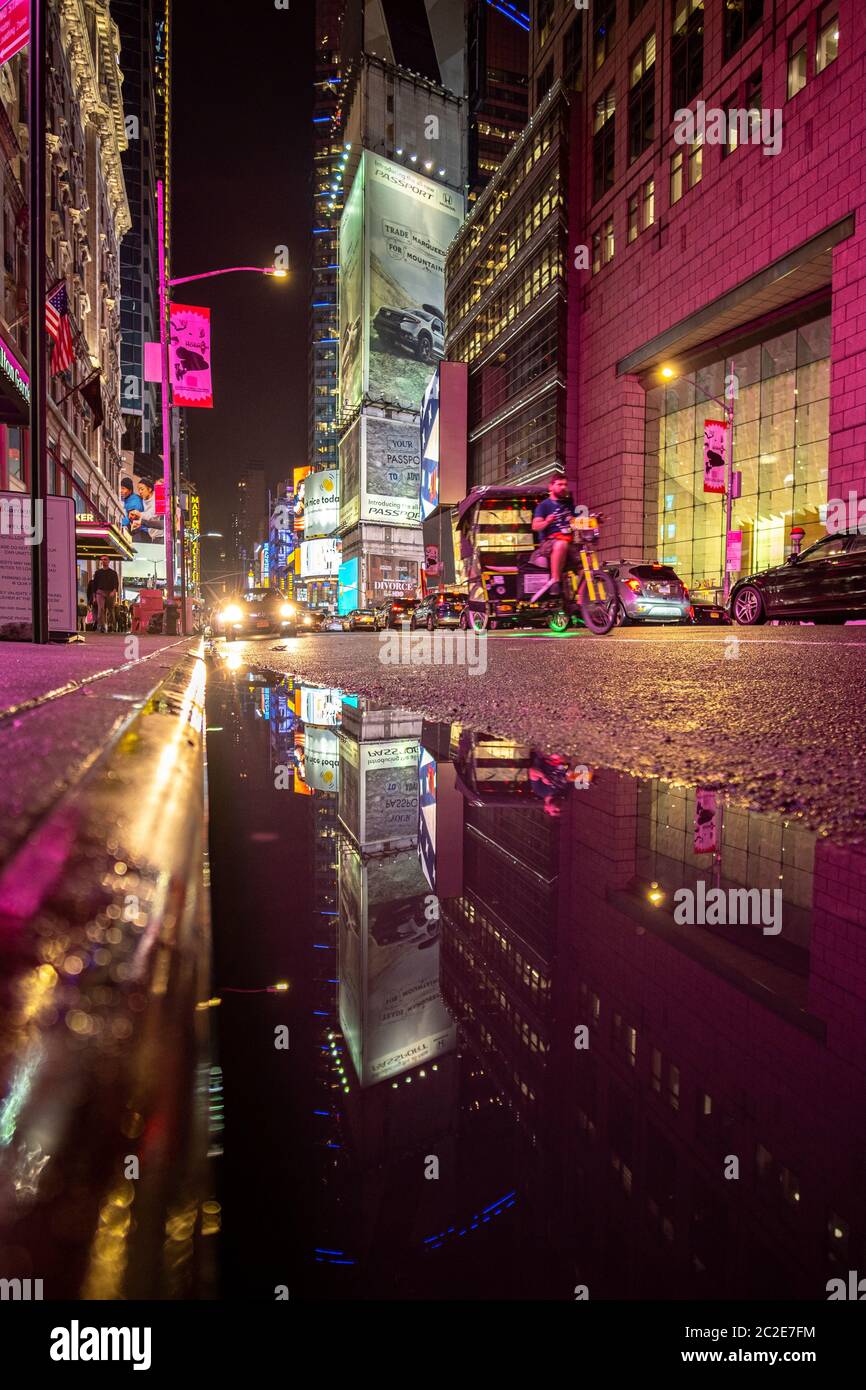 Reflection of raining night on the Times Square in midtown Manhattan ...