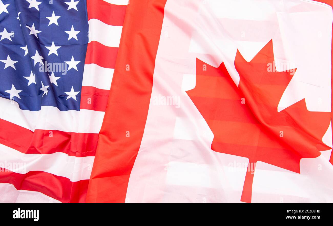 Natural fabric Canada and USA flags as background, Canadian and ...