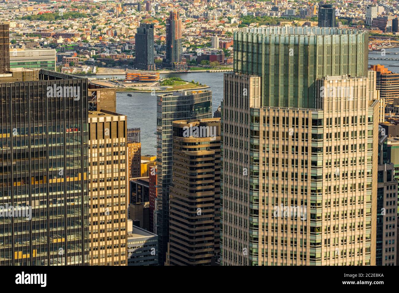 Midtown skyscrapers and Brooklyn buildings view from rooftop ...