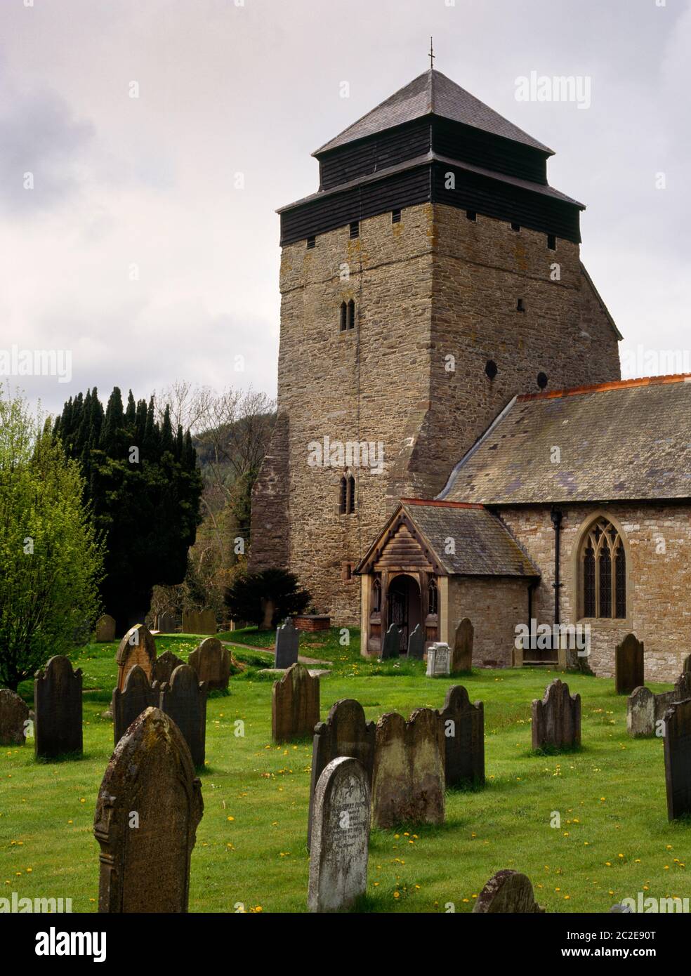 View NW of the Norman tower & two-storeyed timber belfry with a ...