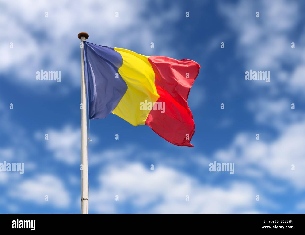 Wind blowing the Romanian flag on the mast Stock Photo - Alamy