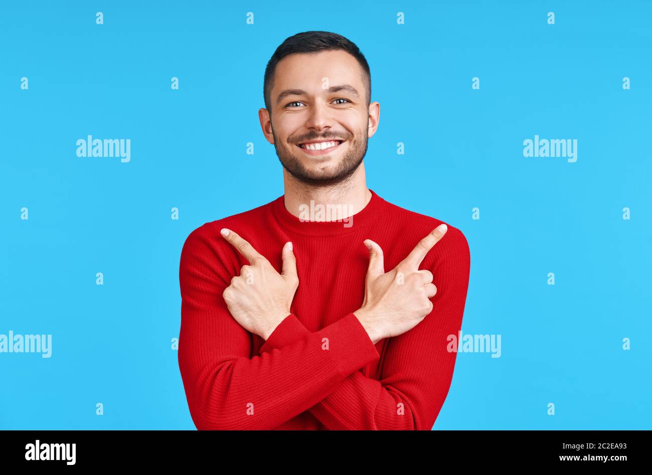Handsome happy man showing empty copy space pointing his fingers Stock ...