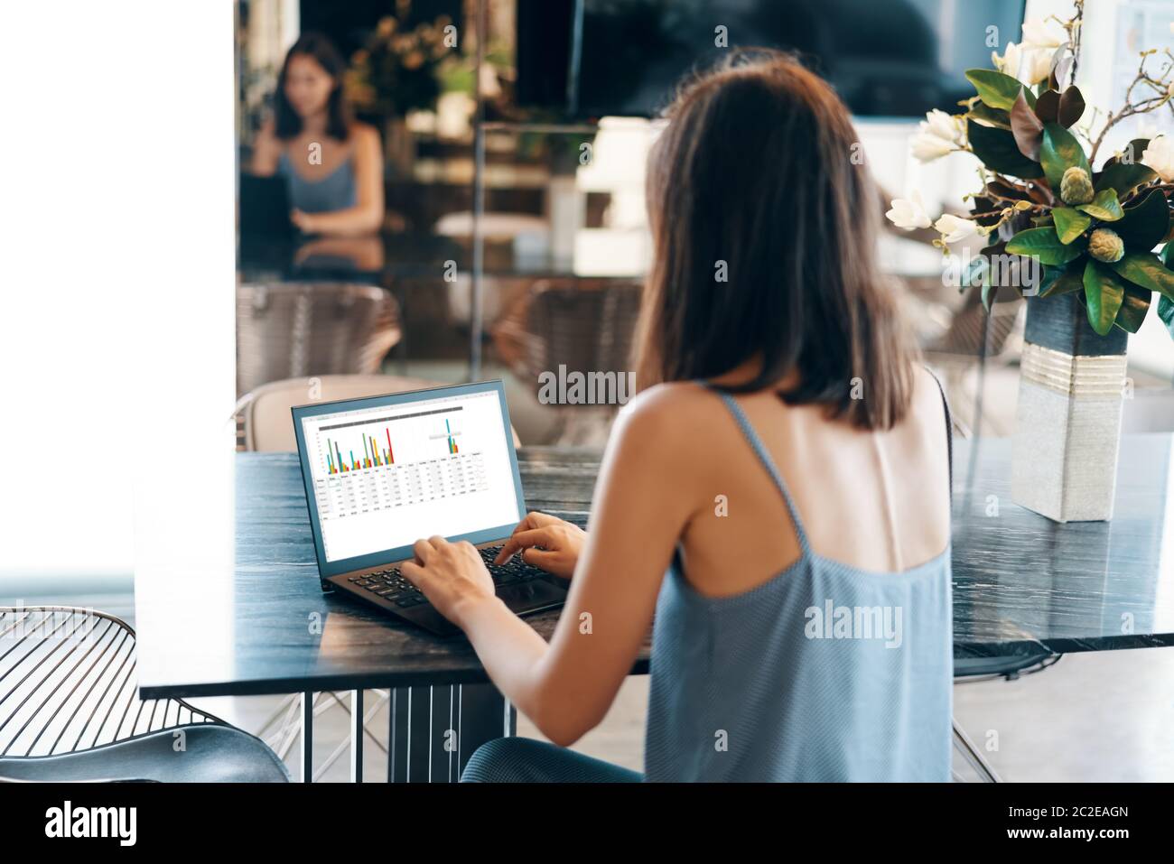 Young girl computer rear view hi-res stock photography and images - Alamy