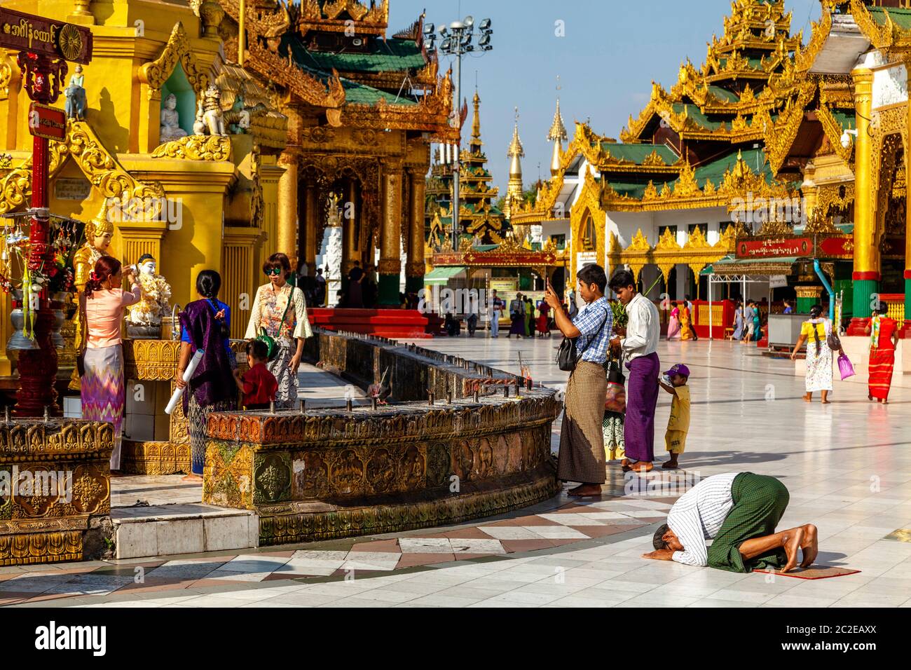 A Buddhist Man Praying At The Shwedagon Pagoda, Yangon, Myanmar Stock ...