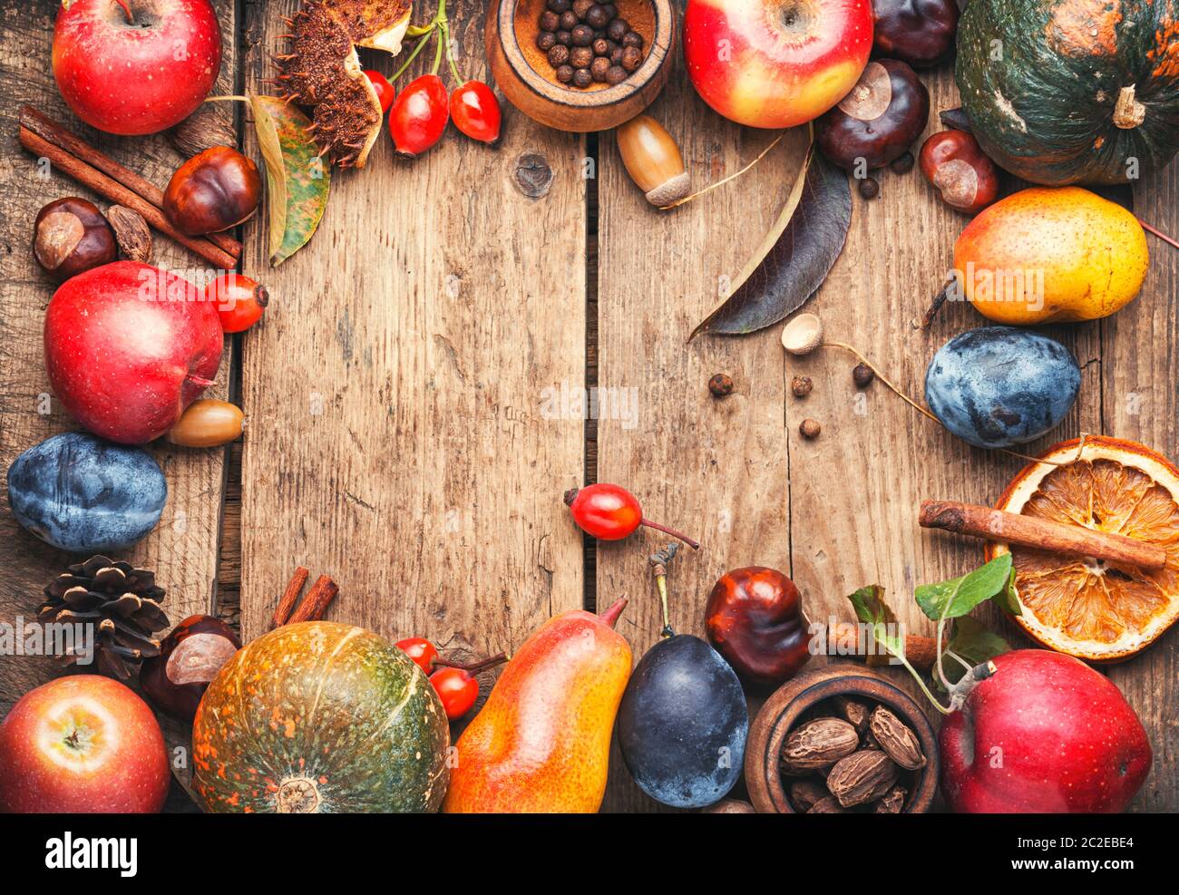 Fruits and pumpkins,nut in autumn still life on wooden table.Fall still ...