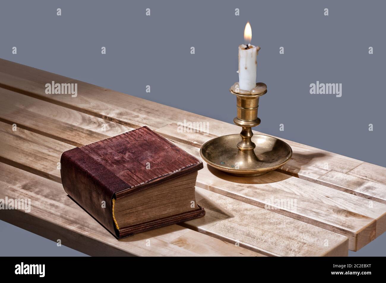Book And Candle Stock Photo - Alamy