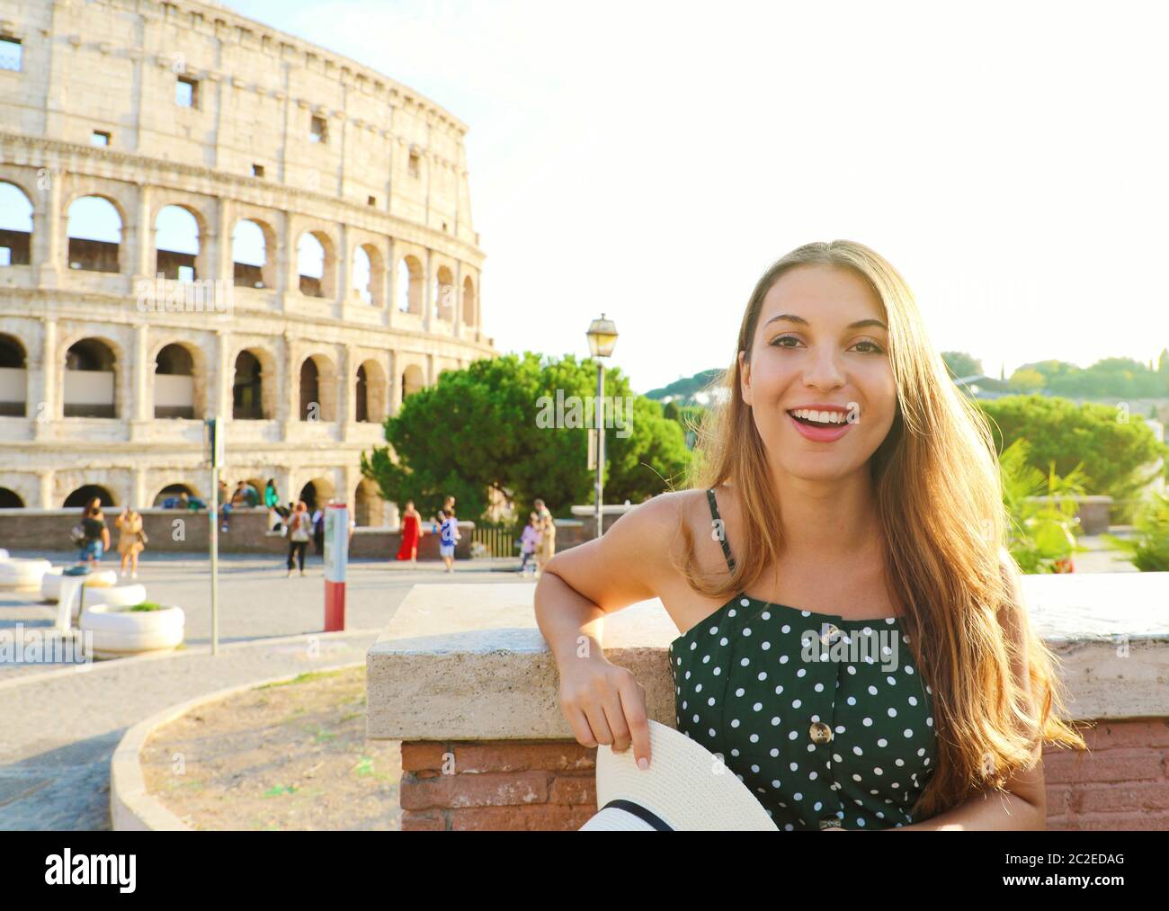 Happy smiling beautiful tourist girl in Rome with Colosseum on the ...