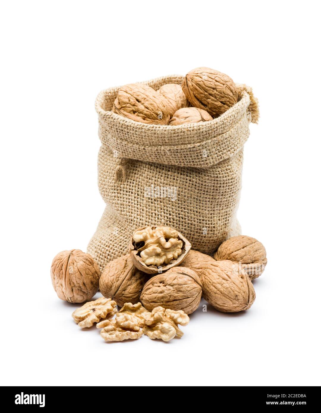 pile of walnuts in juta bag on white background Stock Photo - Alamy