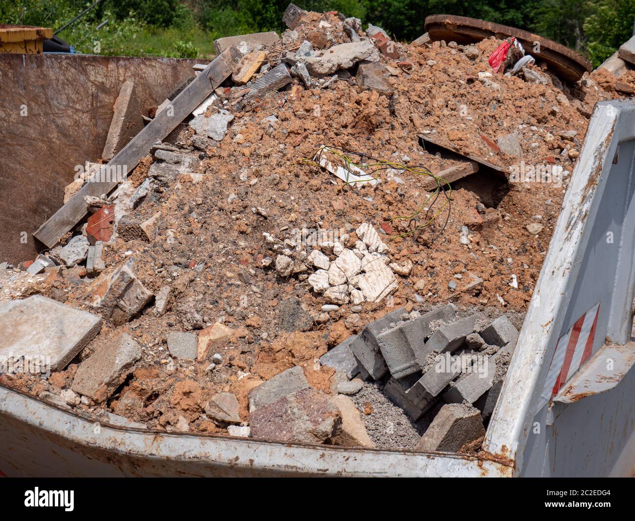 Building rubble in the container renovation Stock Photo - Alamy