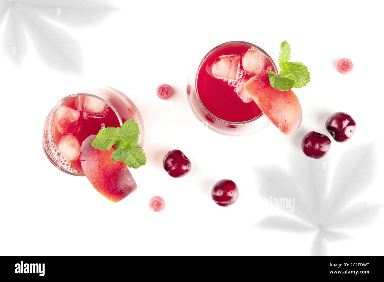 Vibrant red mocktails with fresh fruit and organic shadows Stock Photo ...