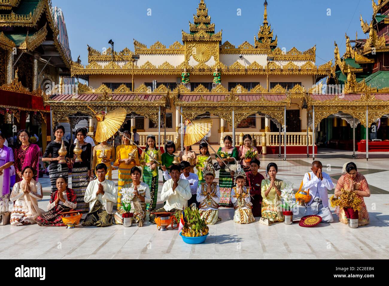 A Family Praying At A Novitiation/Shinbyu Ceremony At The Shwedagon ...