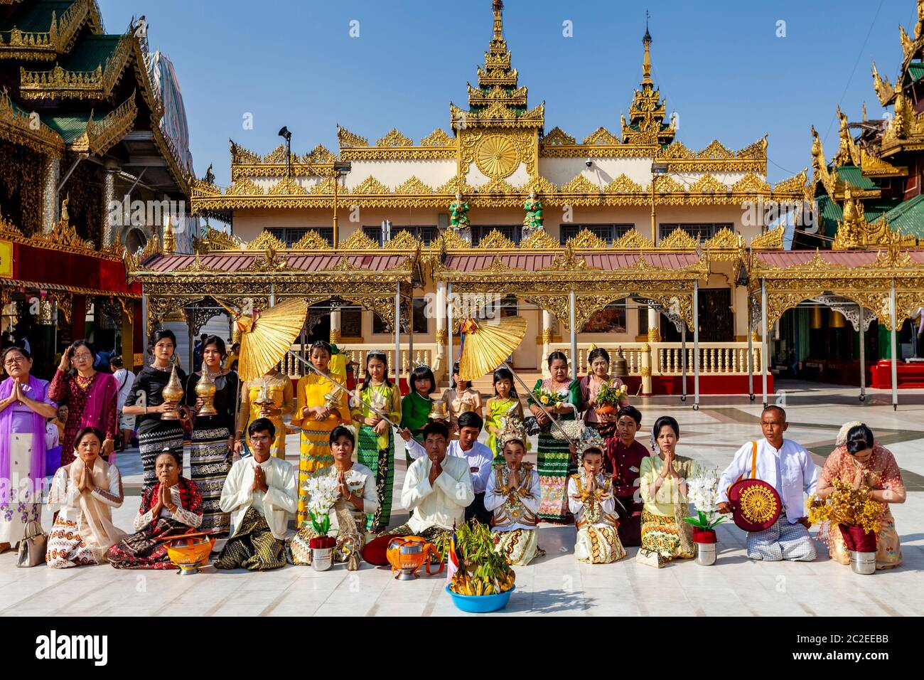 A Family Praying At A Novitiation/Shinbyu Ceremony At The Shwedagon ...
