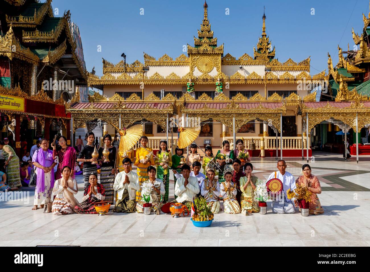 A Family Praying At A Novitiation/Shinbyu Ceremony At The Shwedagon ...