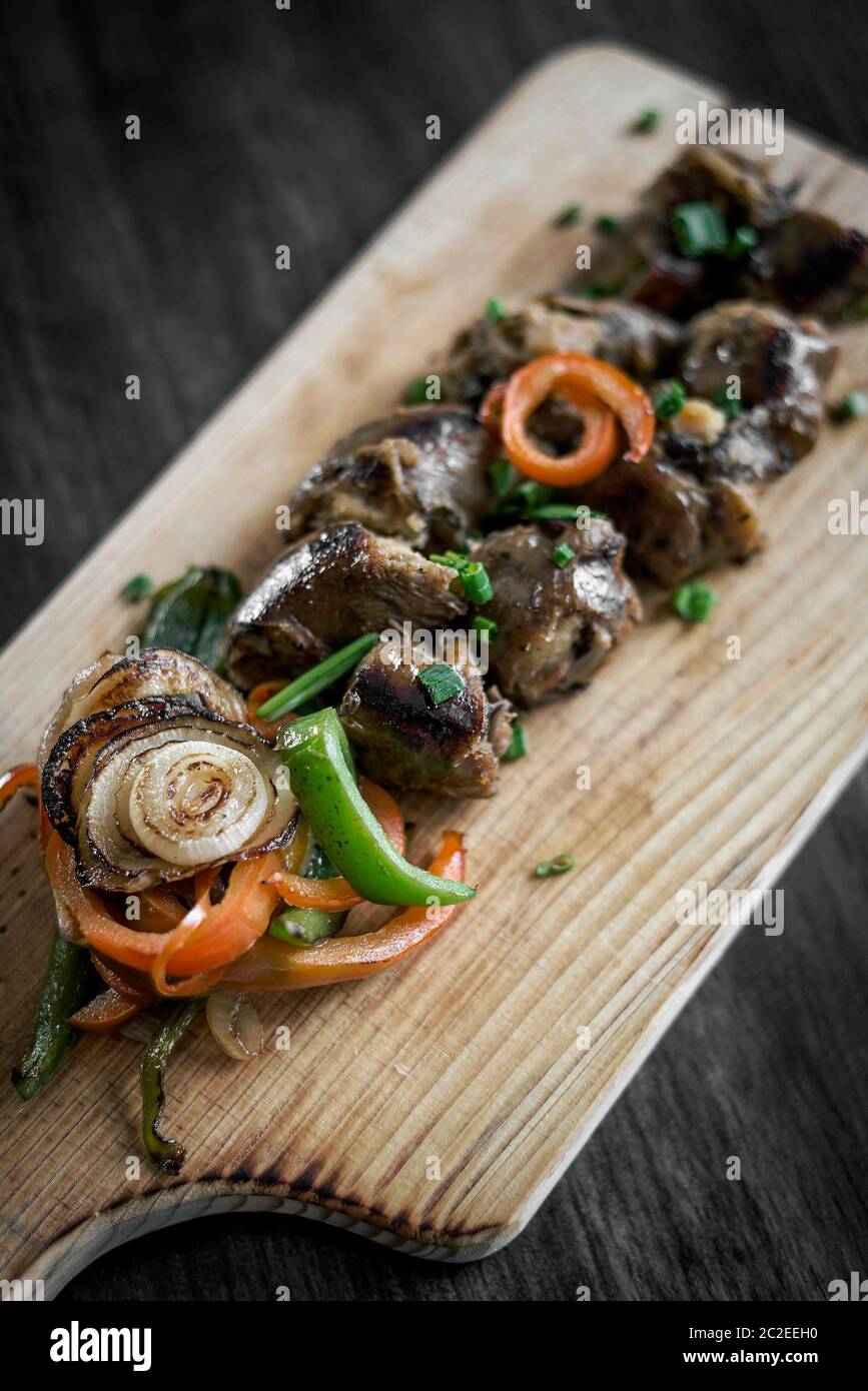 grilled fresh sausage starter tapas snack set on rustic wood board ...