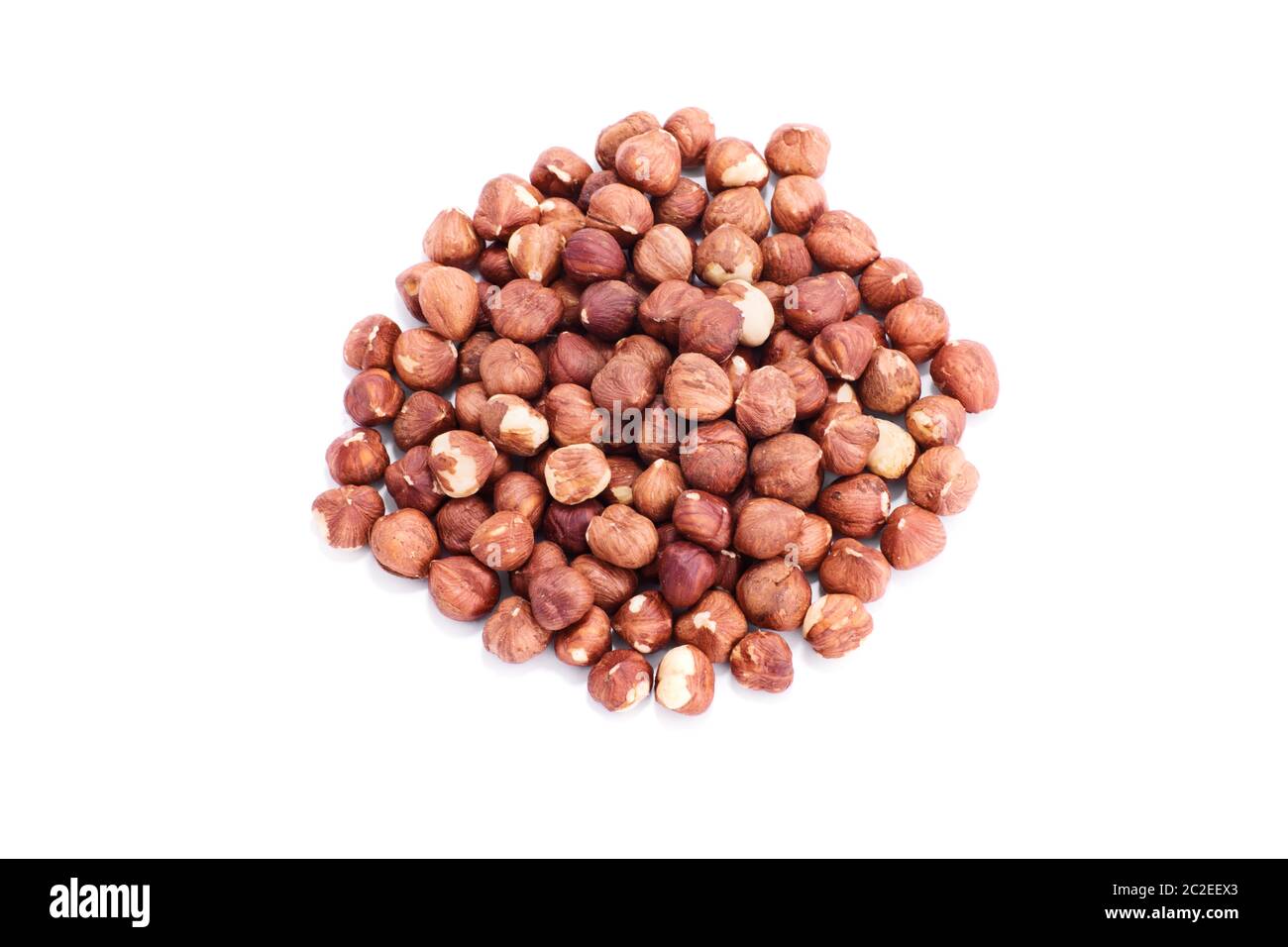 Top perspective of a heap of hazelnuts, isolated on white background ...
