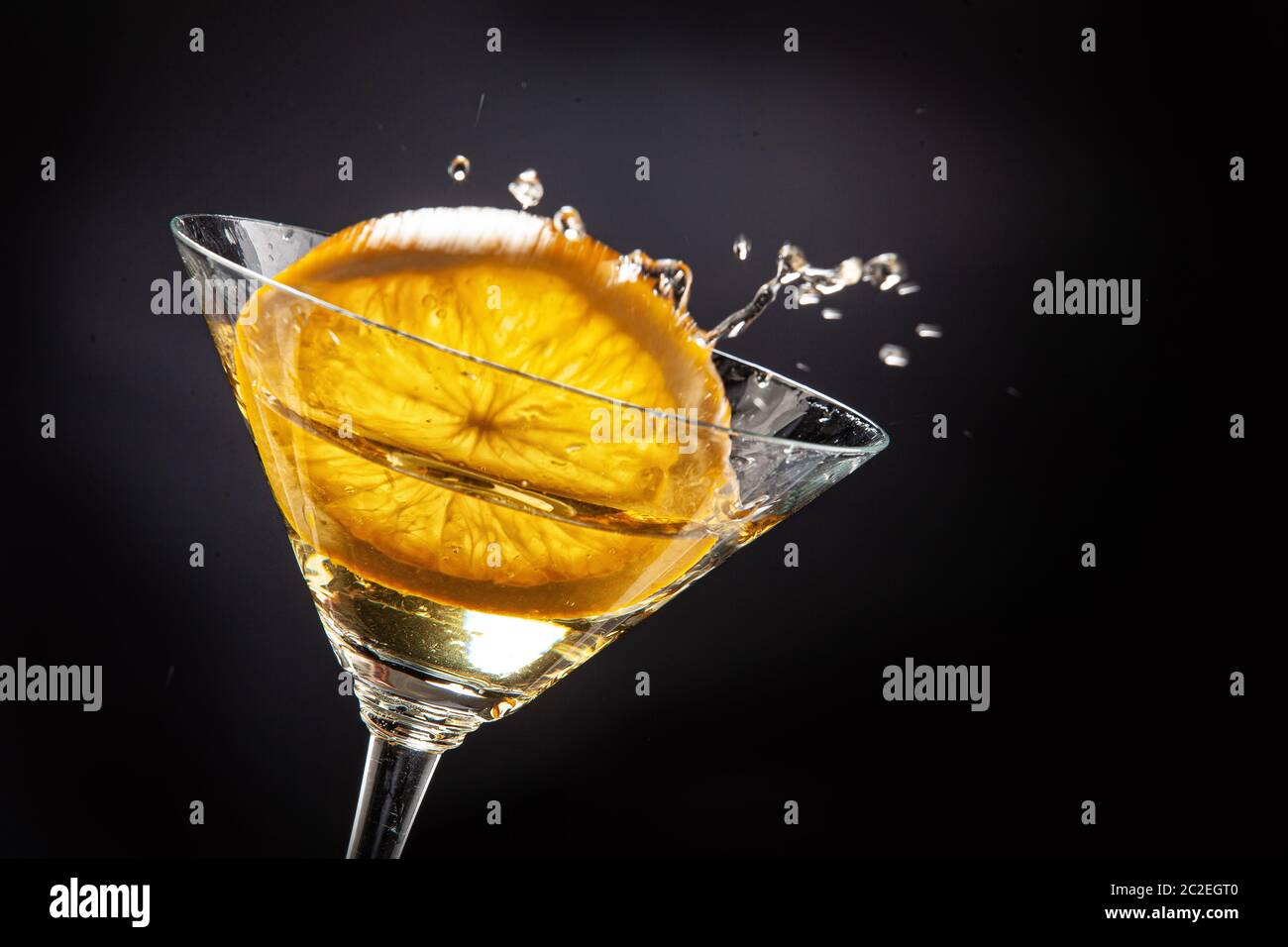Splash orange juice falling glass hi-res stock photography and images ...