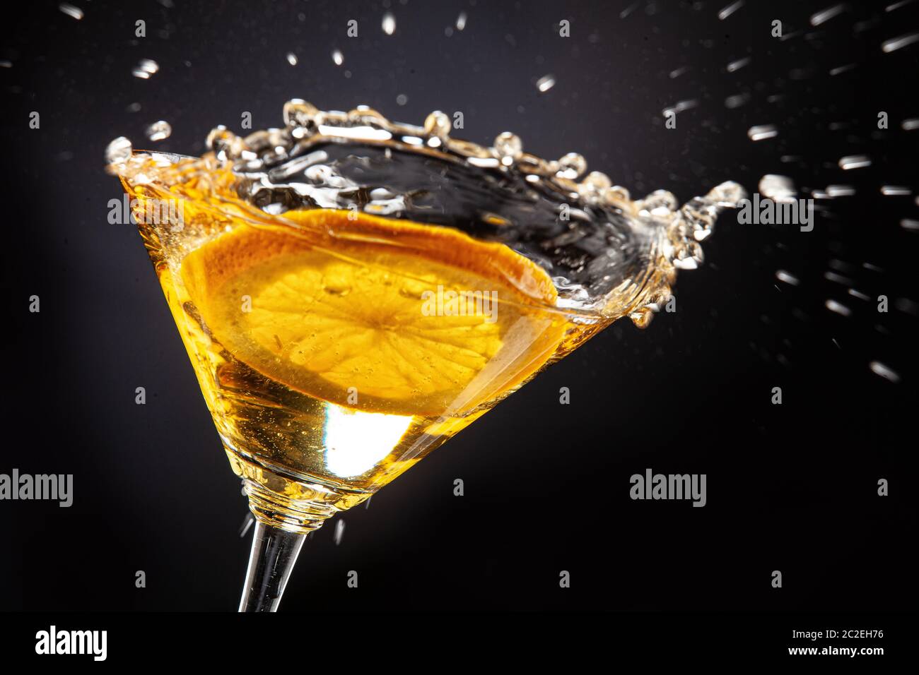 Splash orange juice falling glass hi-res stock photography and images ...