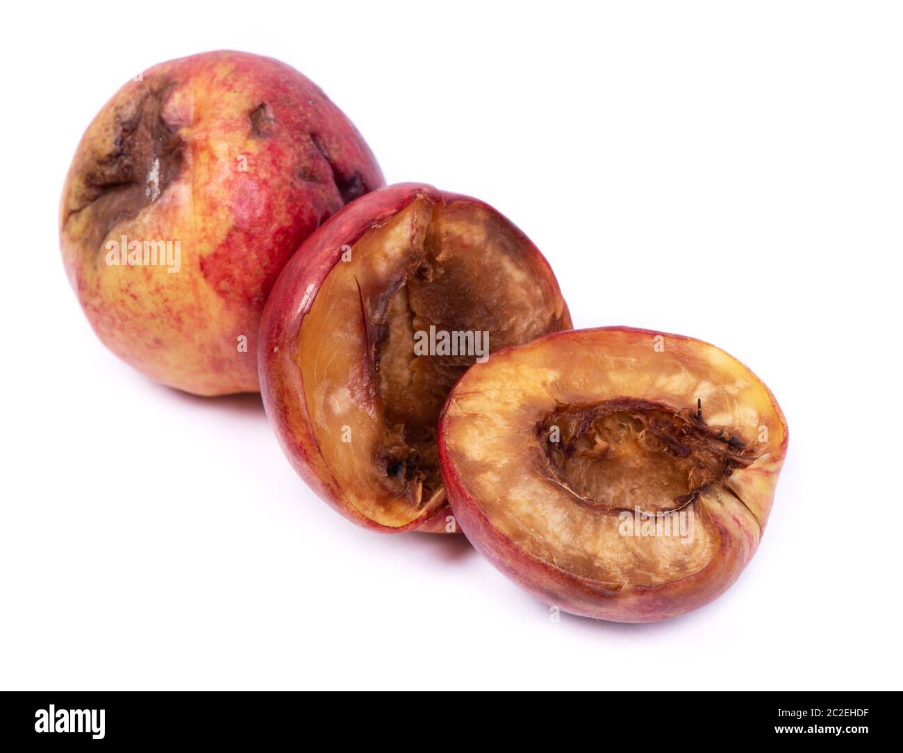 Group of rotten nectarines isolated on white background Stock Photo - Alamy